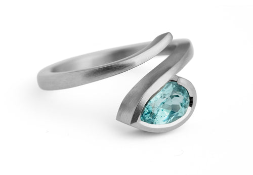 Hand forged platinum and pear shaped paraiba ring